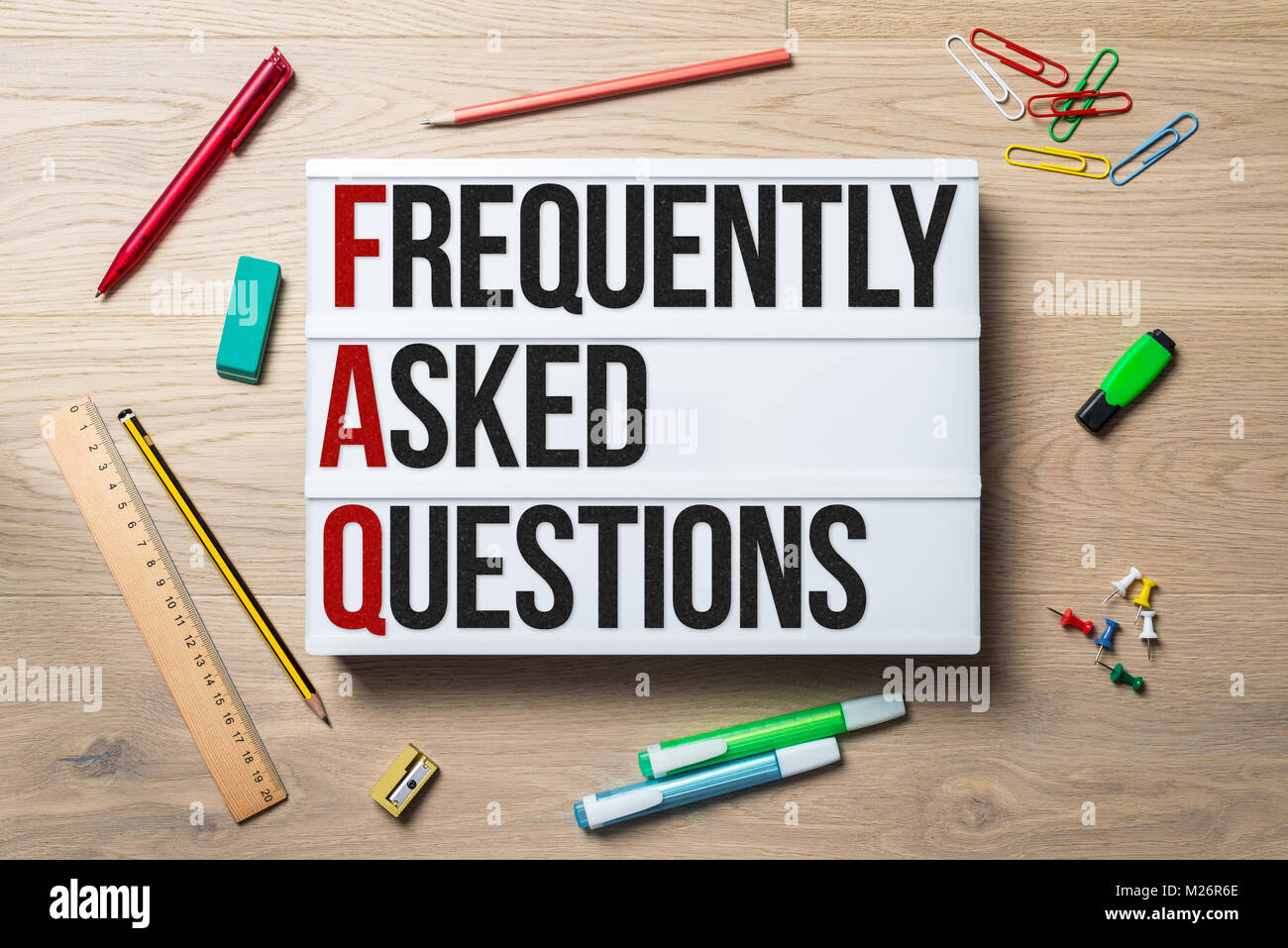 Frequently asked questions writing on lightbox with FAQ being ...