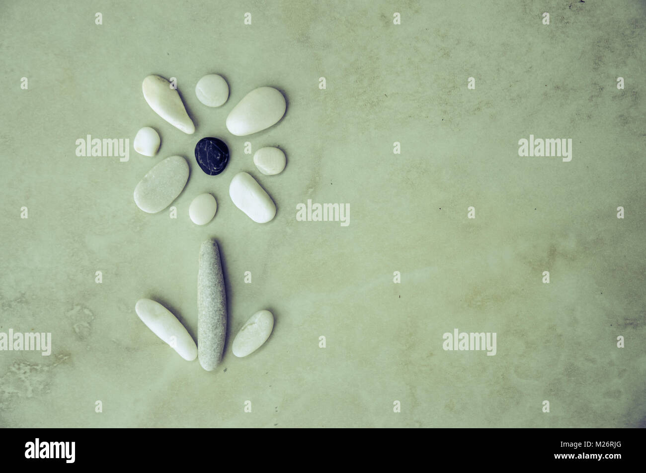 flower made from small pebbles Stock Photo - Alamy