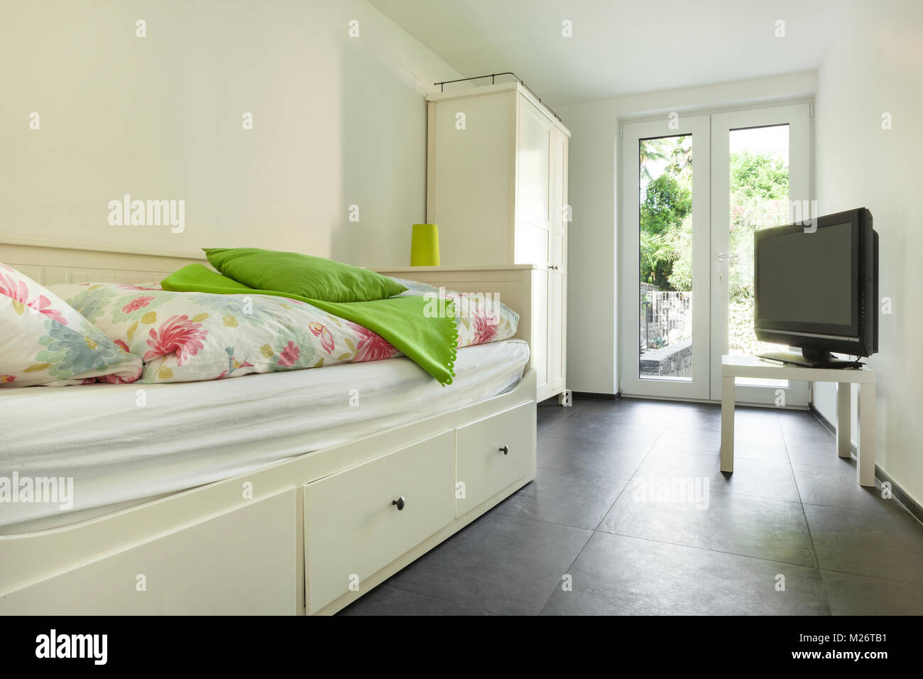 Inside interior guest room bed furniture tv hi-res stock photography ...