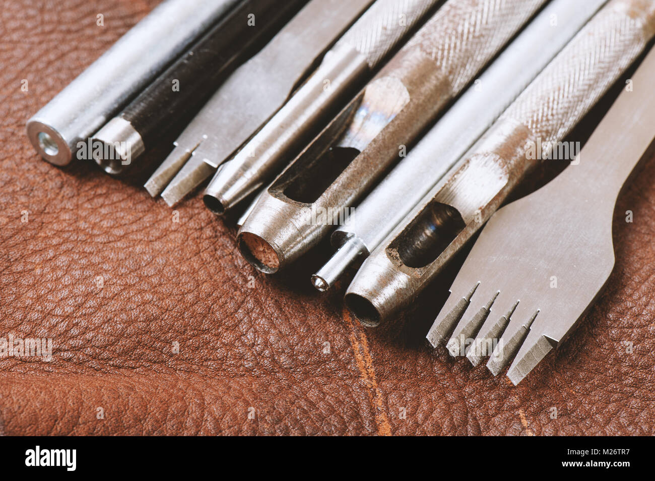 variety of punching tools for leather work and DIY Stock Photo - Alamy