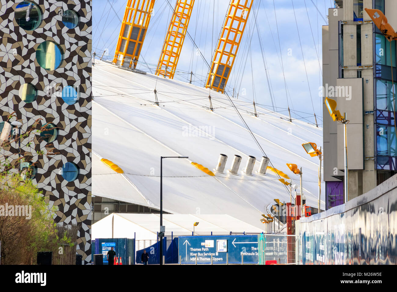 London, UK - February 25, 201 -The O2 Arena seen trough two buildings ...