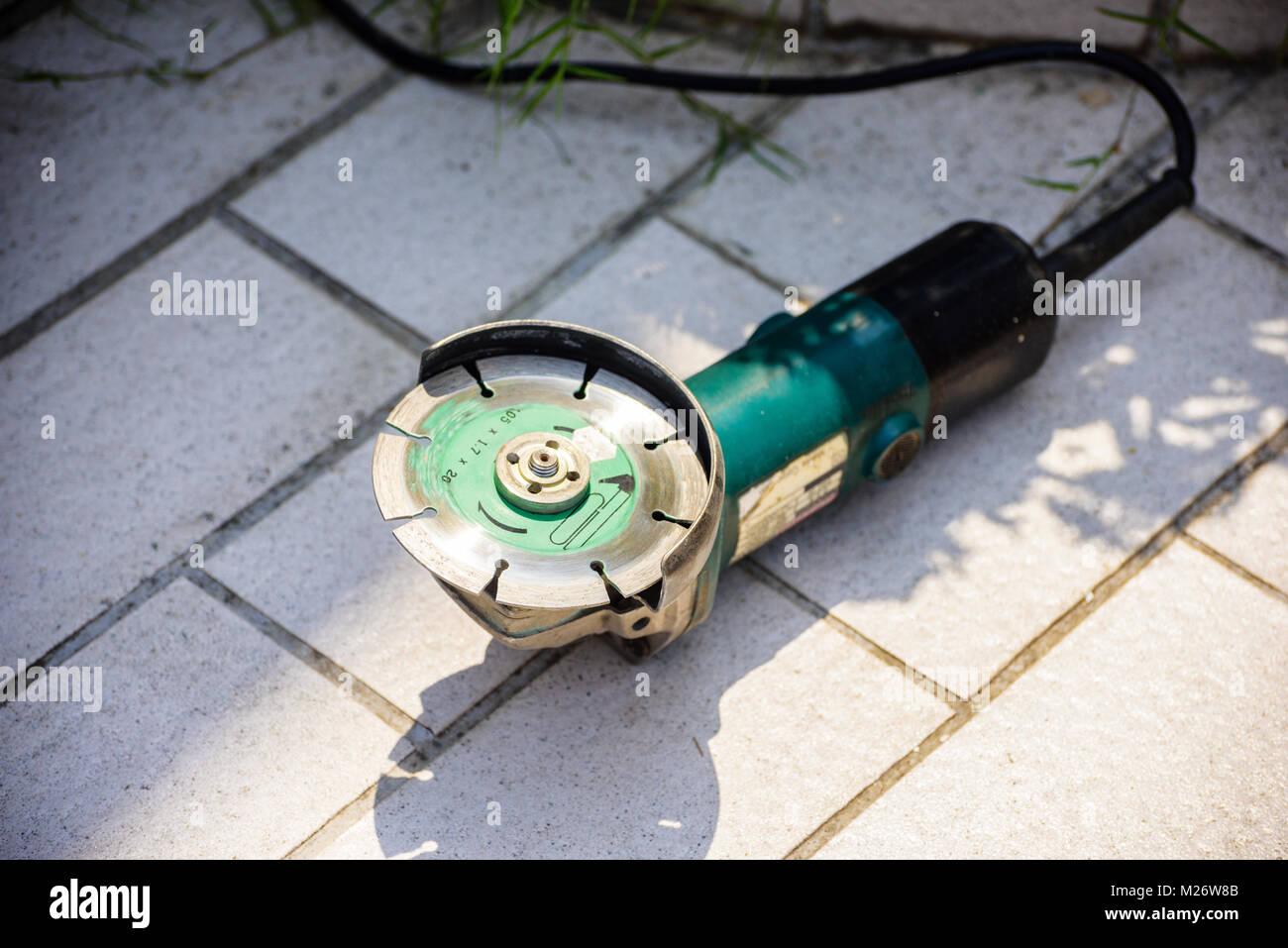 worker cutting ceiling with angle grinder in construction site Stock ...