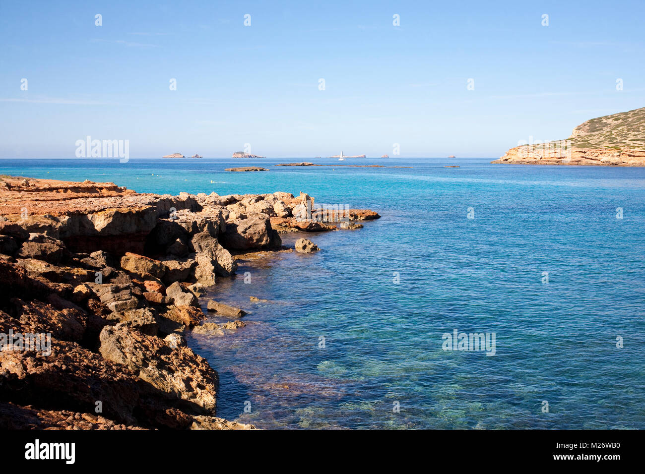 rocky isles in the blue Mediterranean sea near ibiza Stock Photo - Alamy