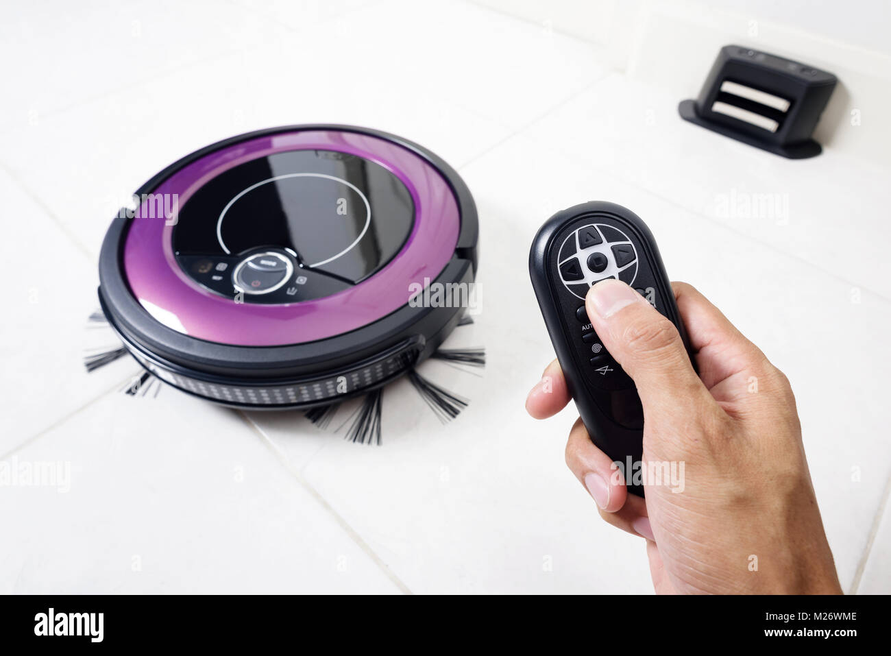 closeup remote control of robotic vacuum cleaner Stock Photo - Alamy