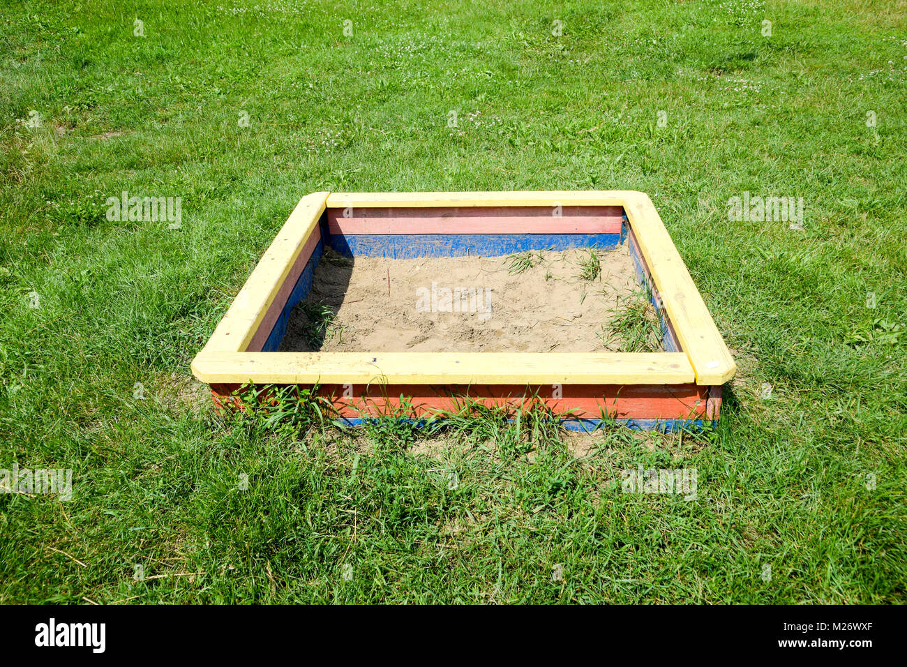 Children's sandbox. Children's playground. Swing, carousel and slide ...