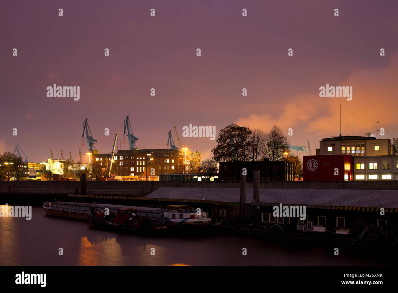 barges and industrial buildings in the port of Hamburg, Germany Stock ...