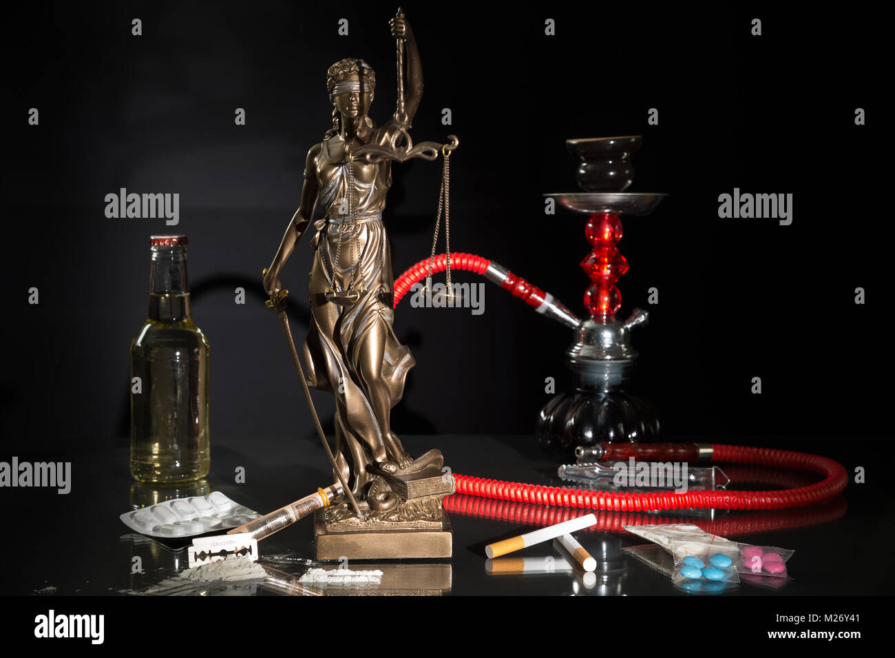 Legal and illegal intoxicants - Justitia statue in the midst of ...