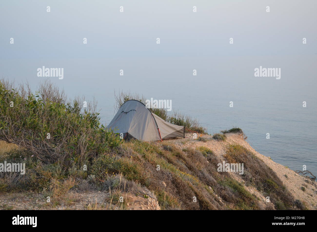Adventure camping spot on a cliff. Tent Stock Photo - Alamy