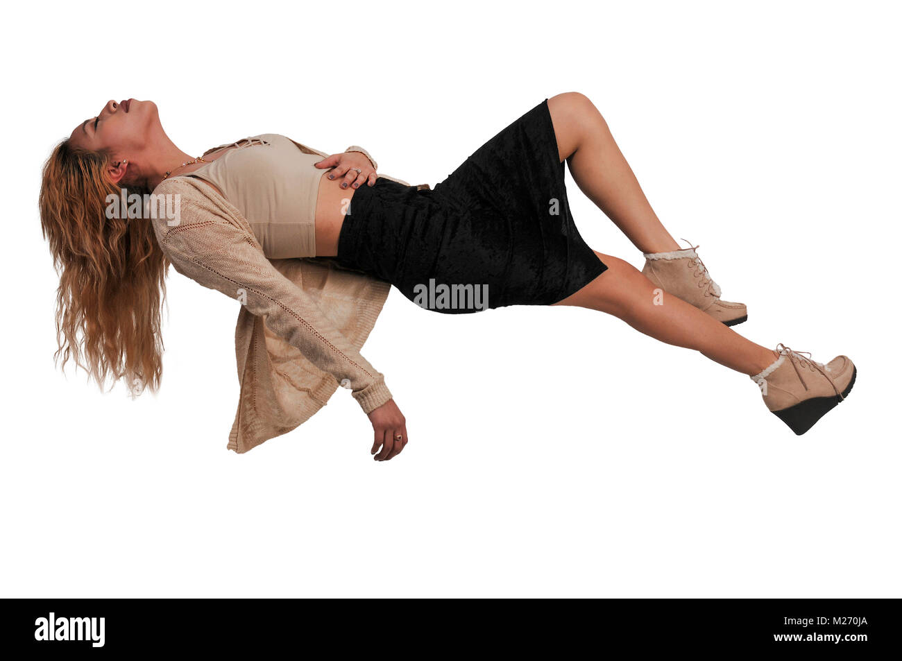 Beautiful young woman floating in the air Stock Photo - Alamy