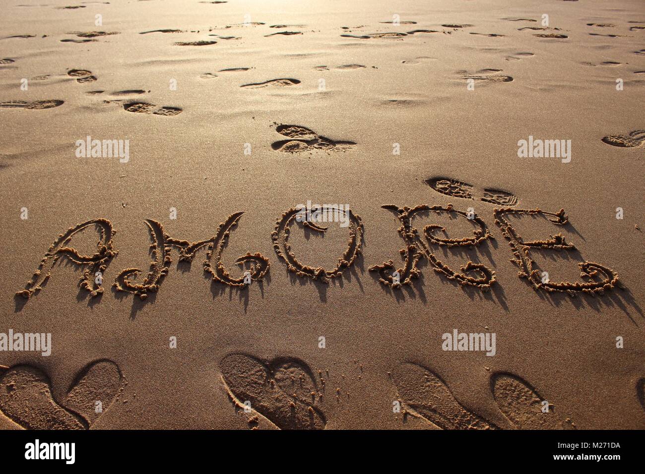 Text written in sand on a nice beach Stock Photo - Alamy