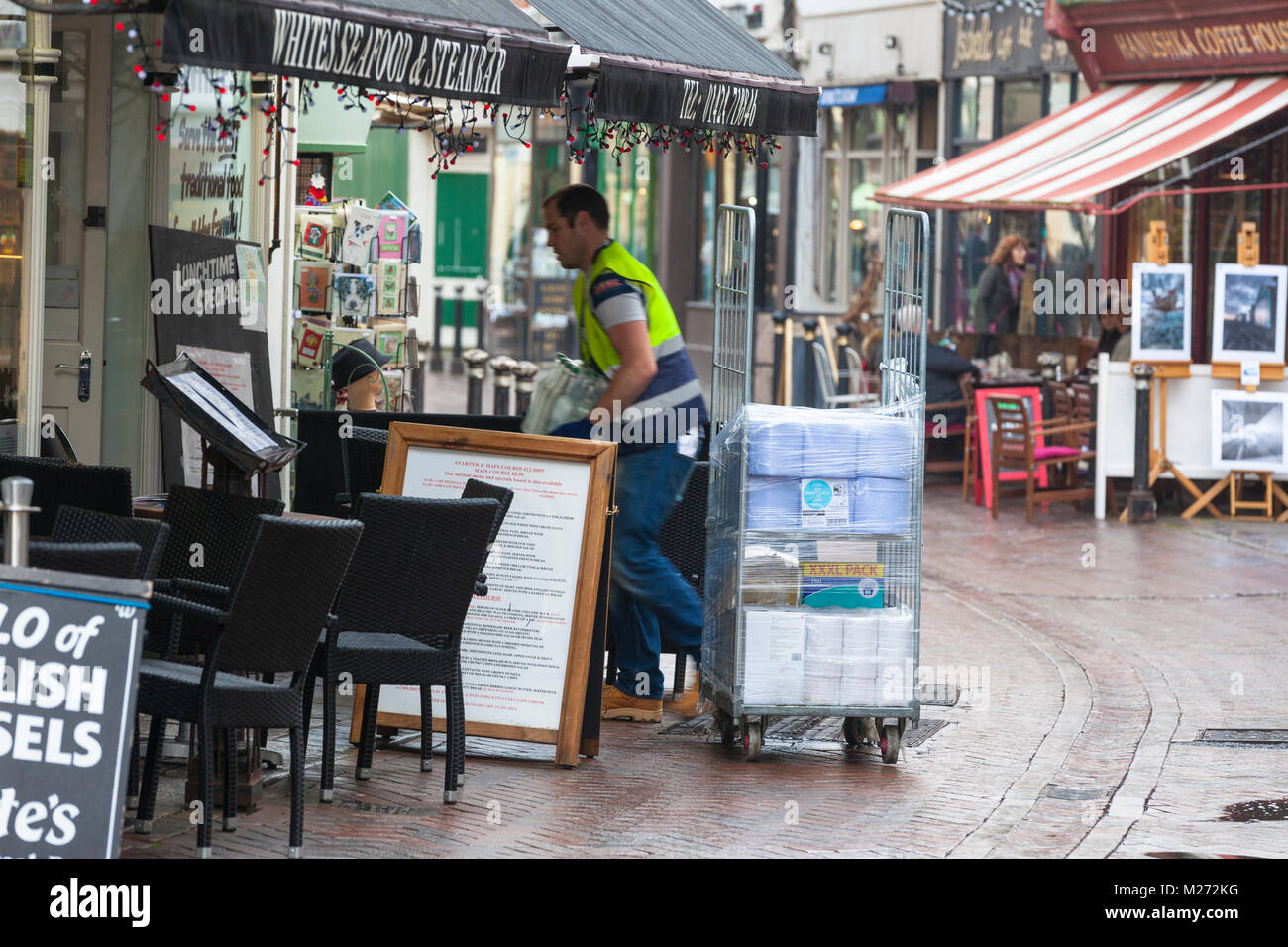 Man pulling trolley hi-res stock photography and images - Alamy