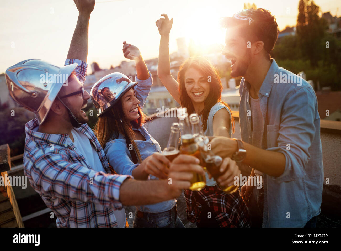 Happy cheerful friends spending fun times together Stock Photo - Alamy