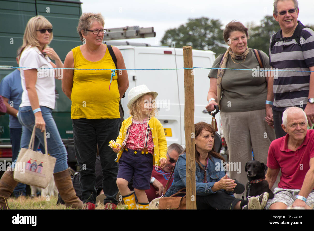 Spectators and a dog on a Summer's day at a Country Show in Hampshire ...