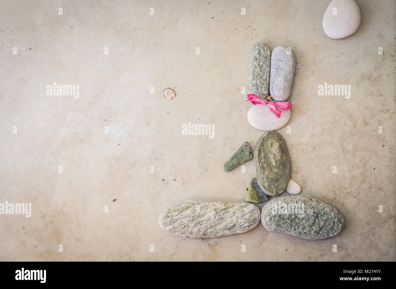group of pebbles in shape of rabbit animal Stock Photo - Alamy