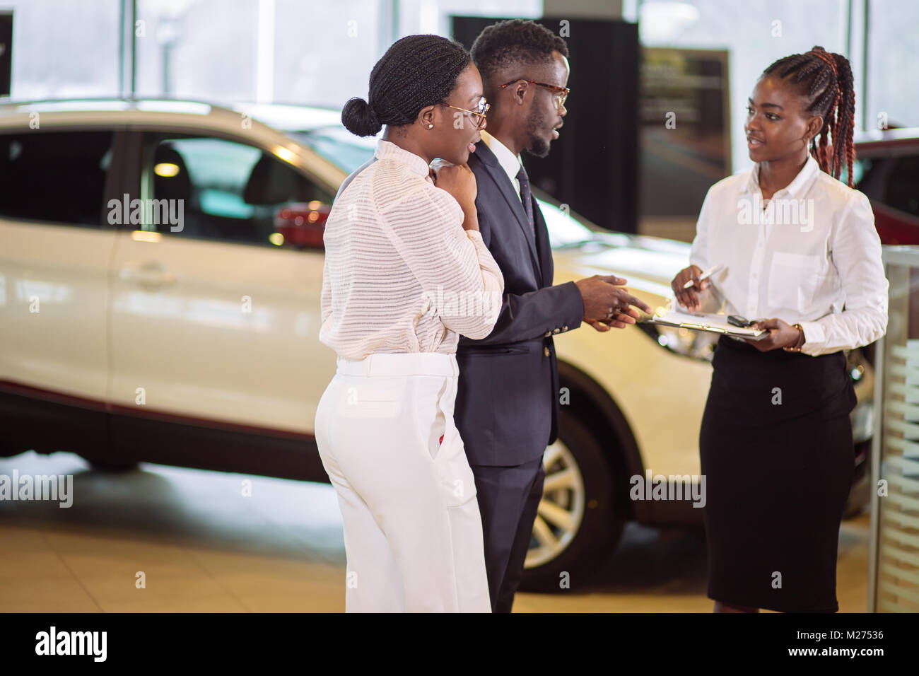 Customers signing some important documents at new car showroom Stock ...