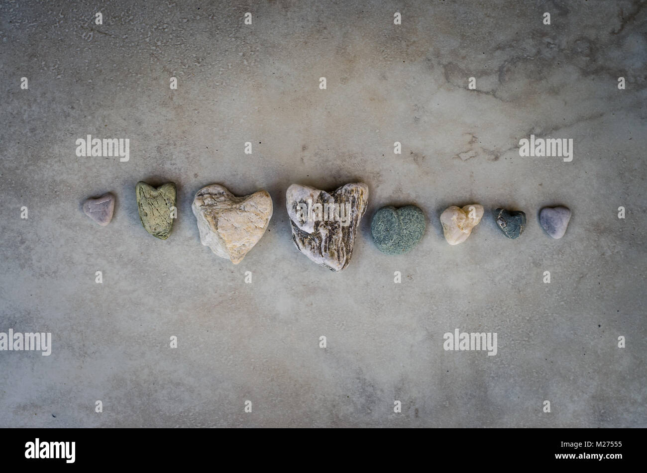 group of heart shaped pebbles decoration Stock Photo - Alamy