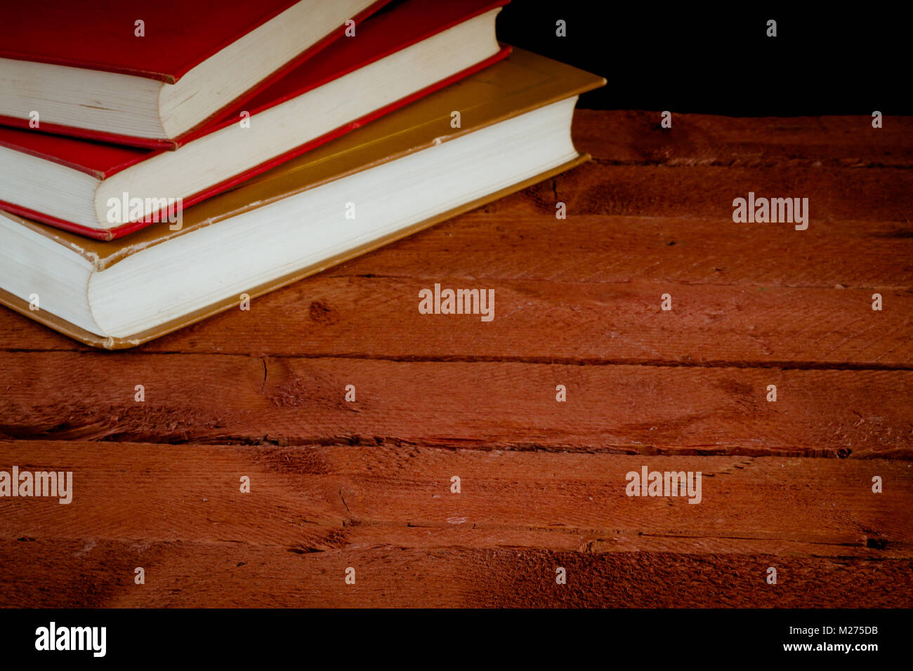 Old books on wooden table Stock Photo - Alamy