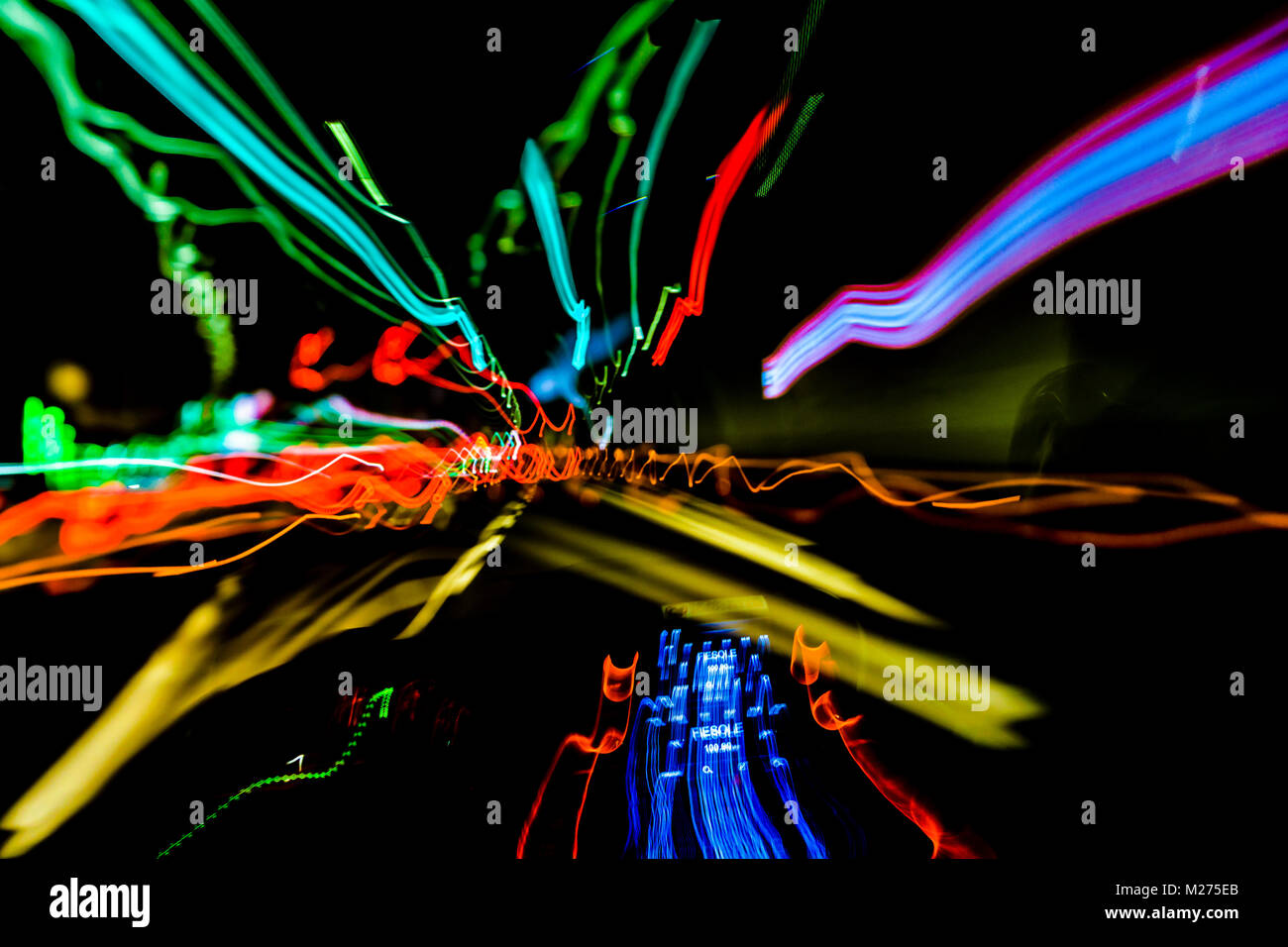 Abstract motion blur design with mixed color shapes against black ...
