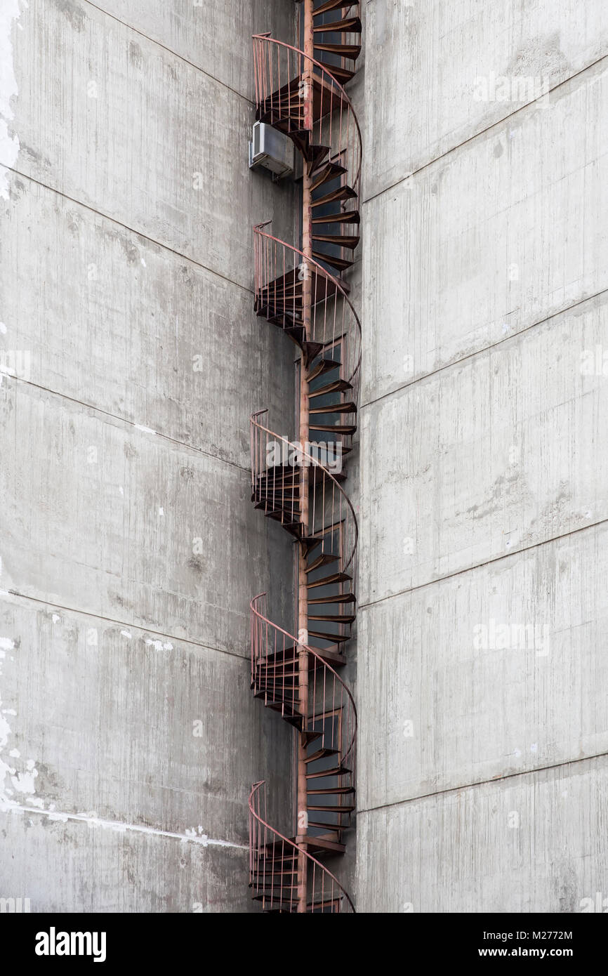Closeup detail of the fire escape at concrete urban building Stock ...