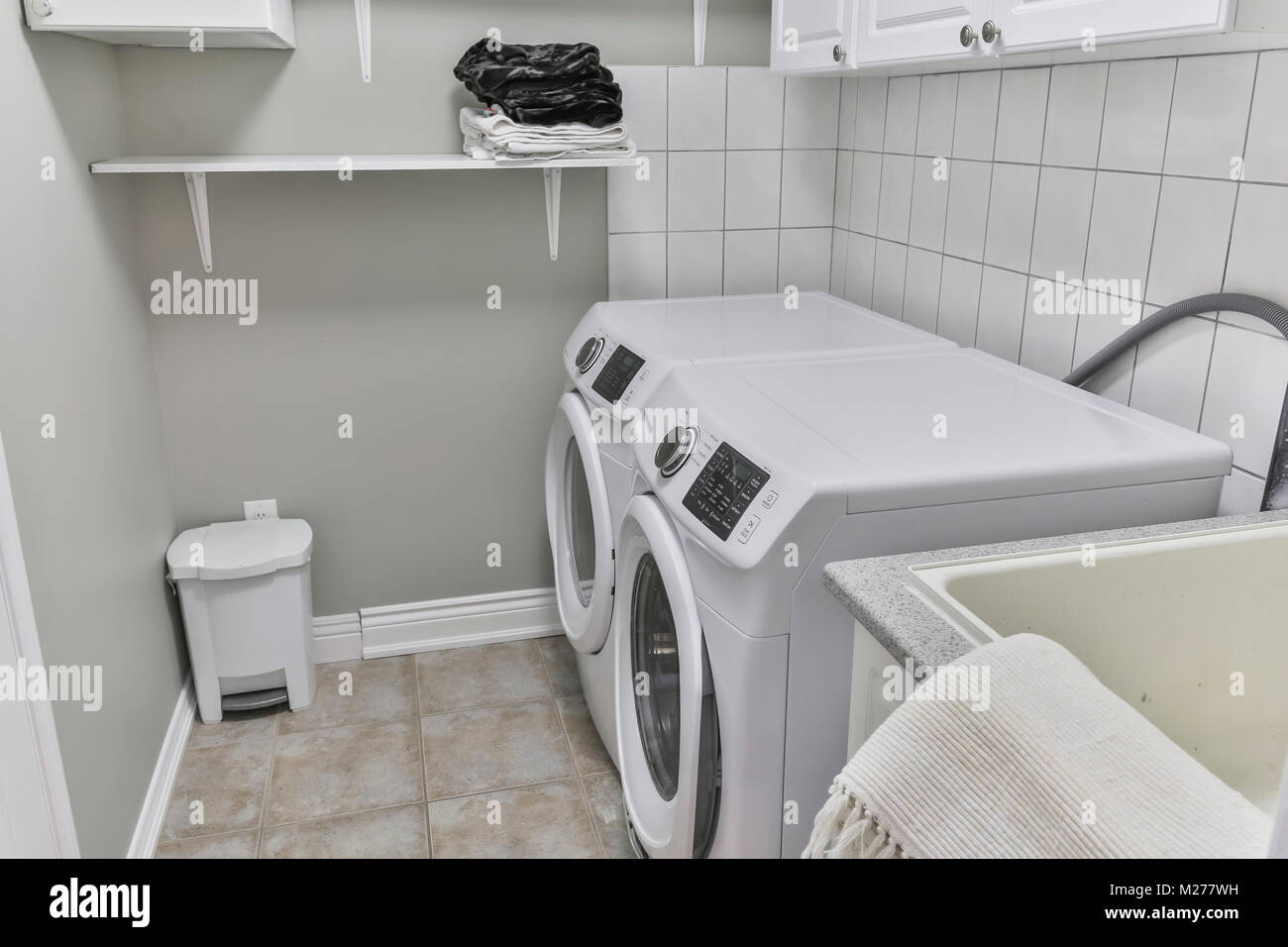 A washing and dryer machine at home. laundry Stock Photo - Alamy