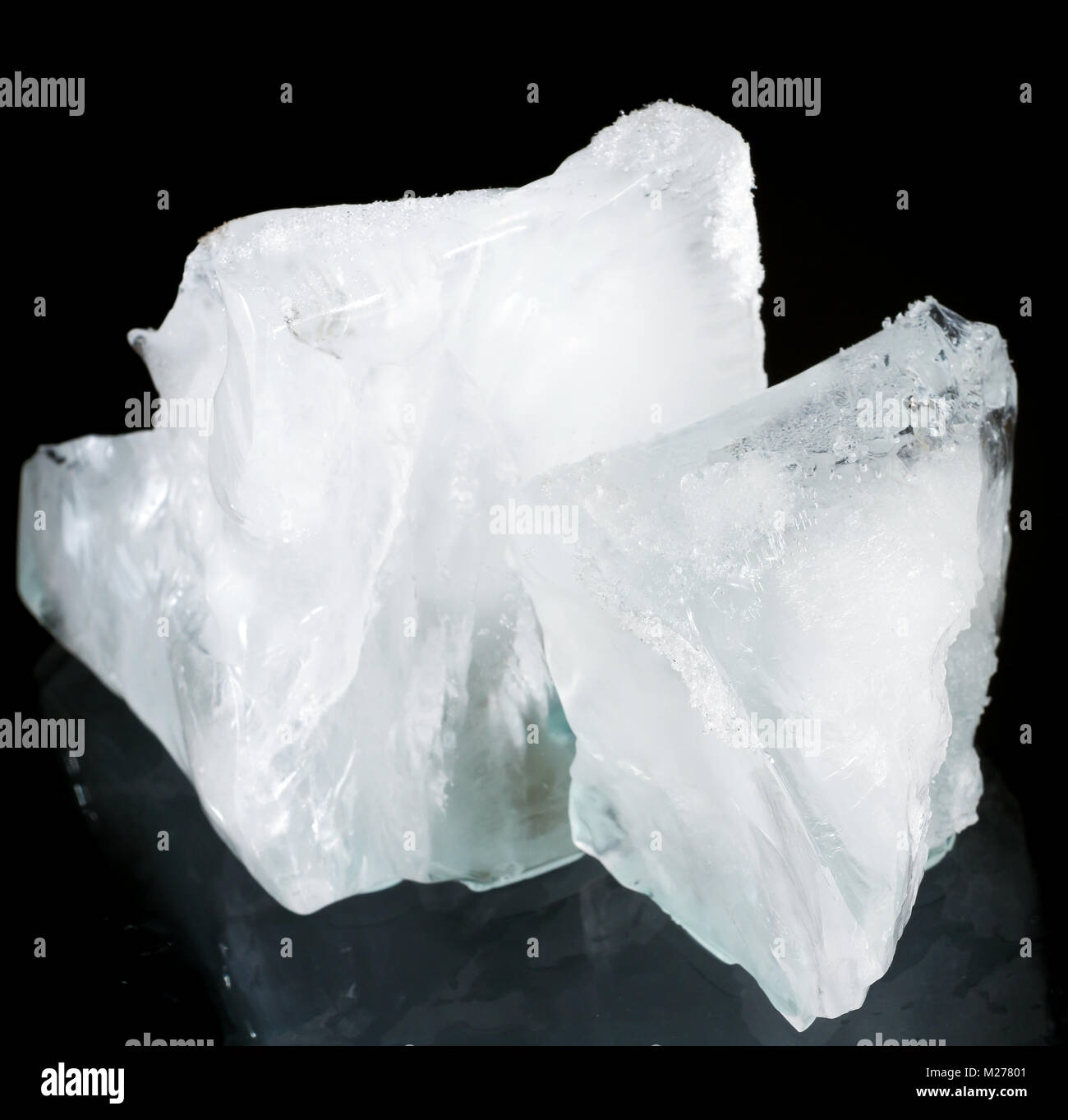 Big pieces of ice on a black background Stock Photo - Alamy