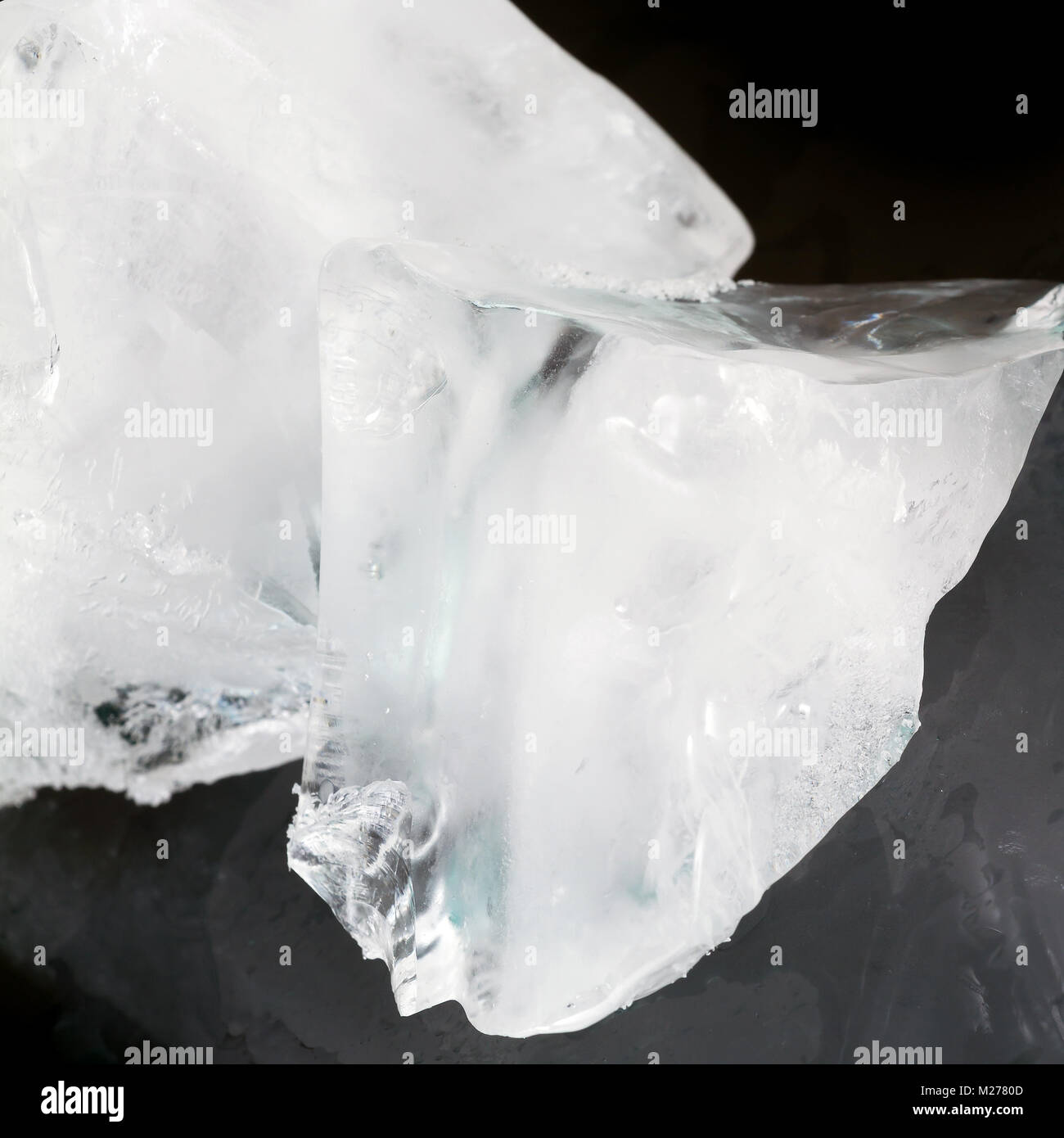 Big pieces of ice on a black background Stock Photo - Alamy