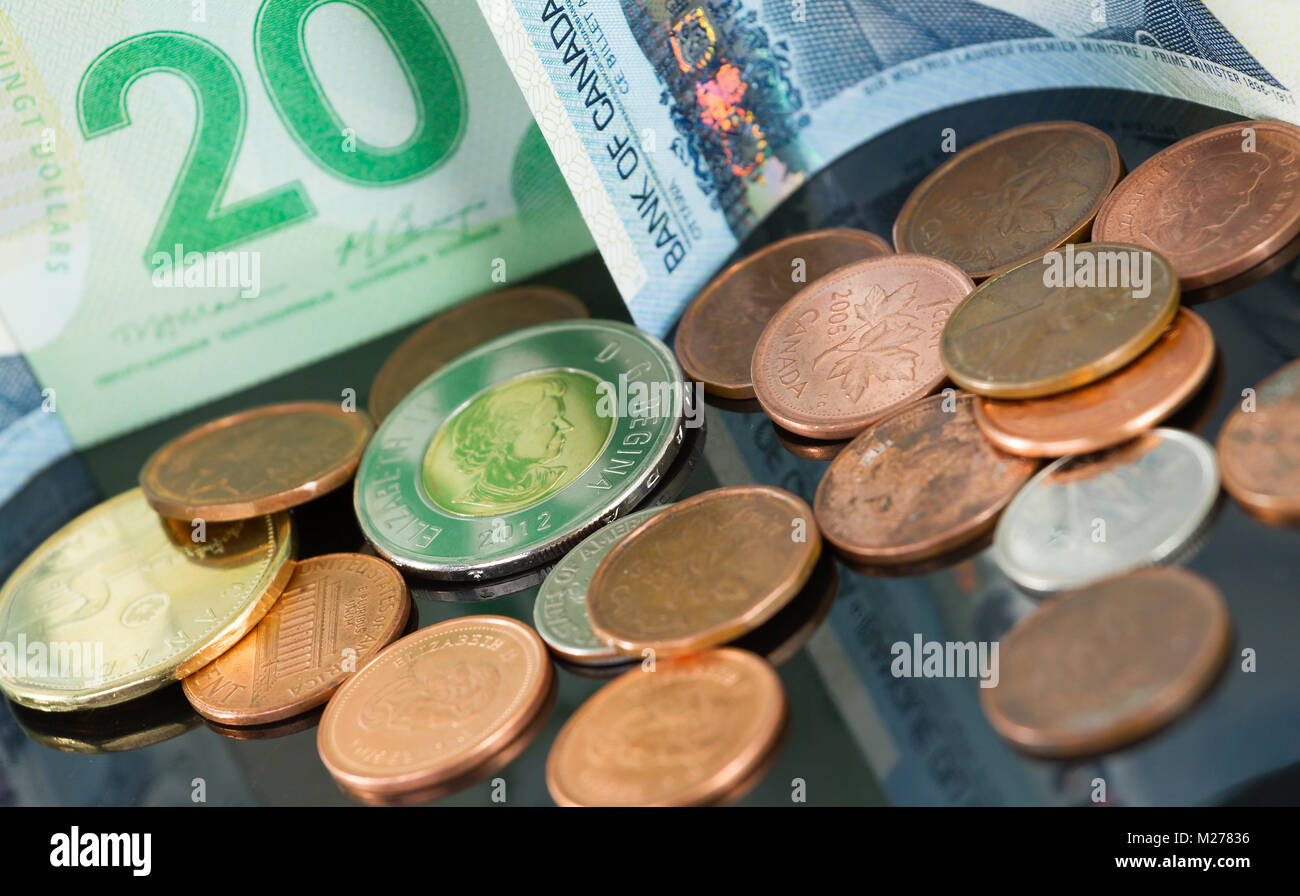 Canadian money on a black background Stock Photo - Alamy