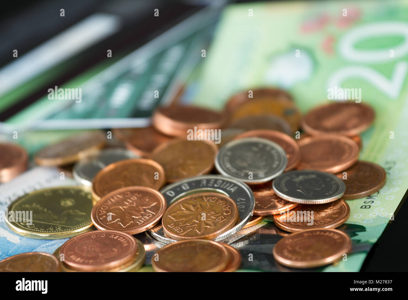 Canadian money on a black background Stock Photo - Alamy