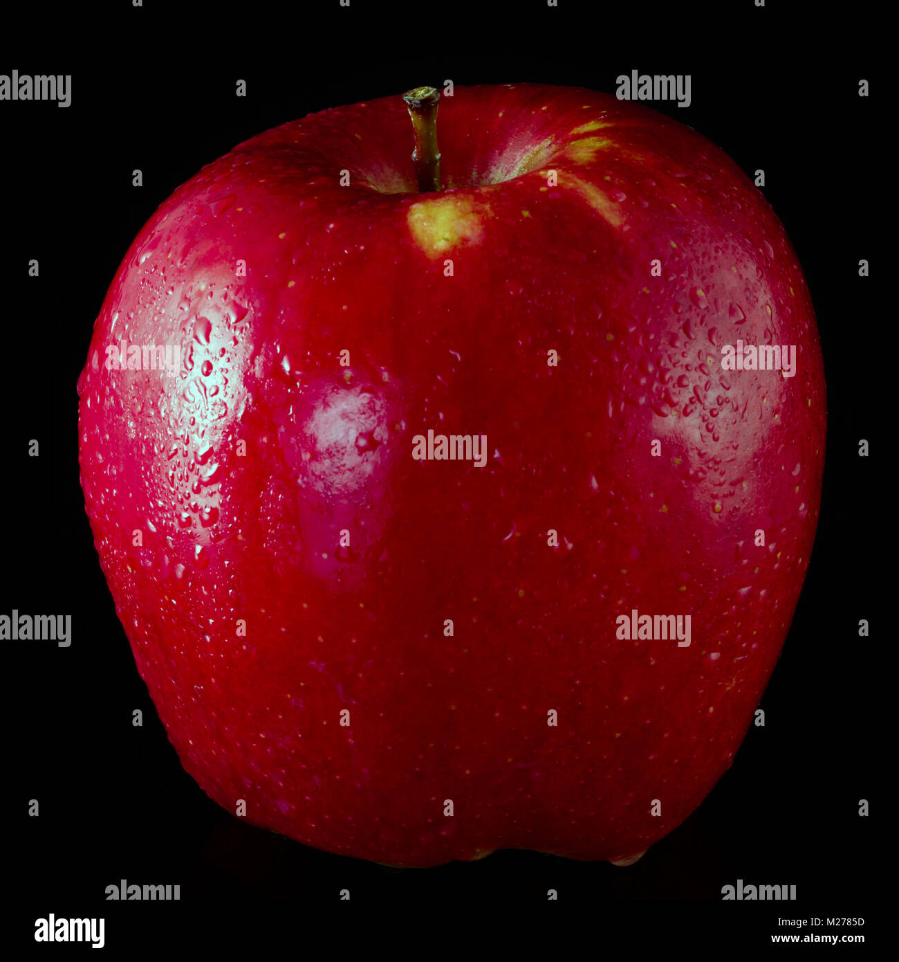 Red apple on a black background Stock Photo - Alamy