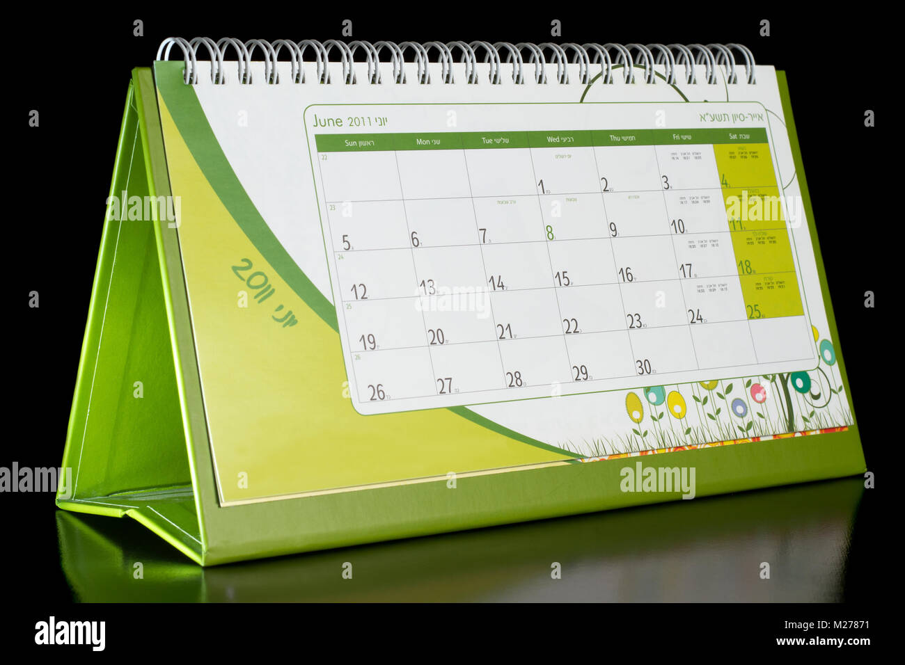 Calendar organizer on black background Stock Photo - Alamy