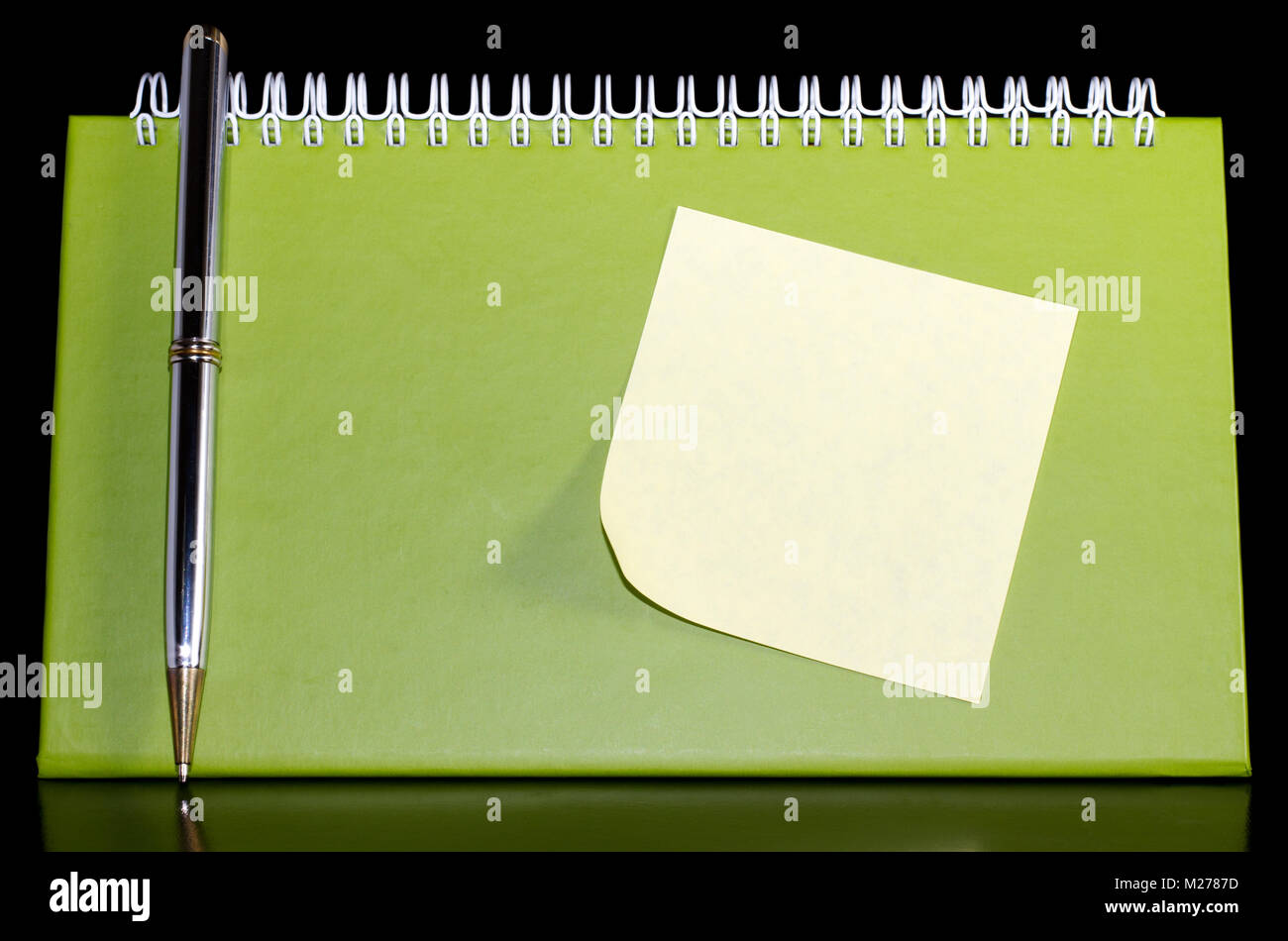 Green blank calendar organizer with pen and noteped Stock Photo - Alamy