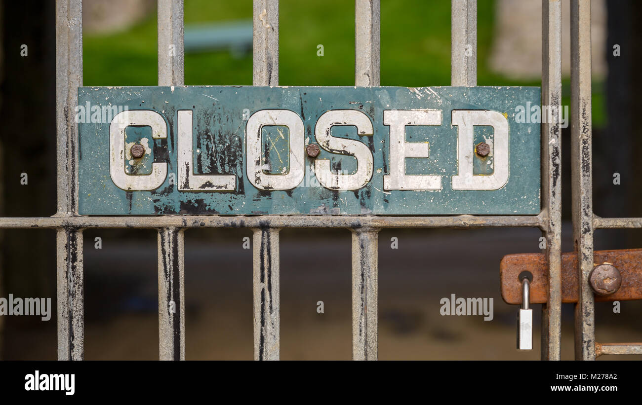 Sign: Closed, with a lock on a gate, seen in Swansea, Wales, UK Stock ...