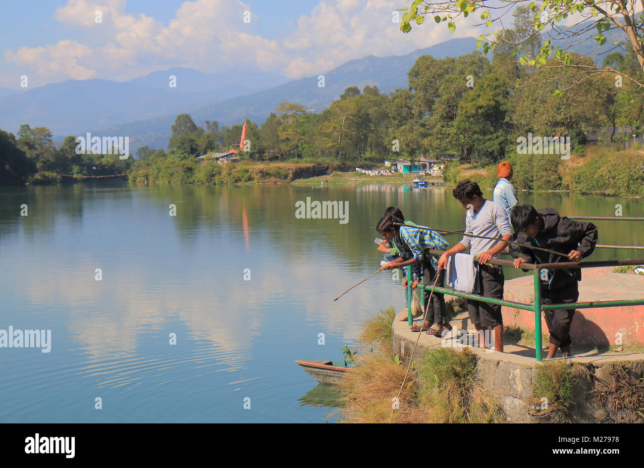 People fish at Dam Side Park in Pokhara Nepal Stock Photo - Alamy
