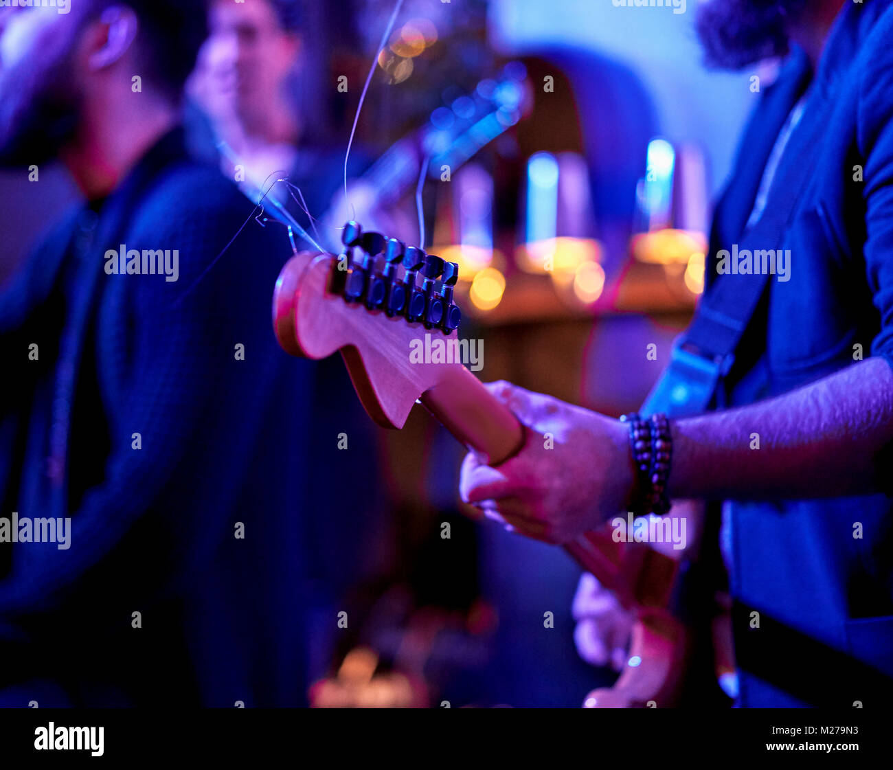 musician plays guitar in the club Stock Photo - Alamy