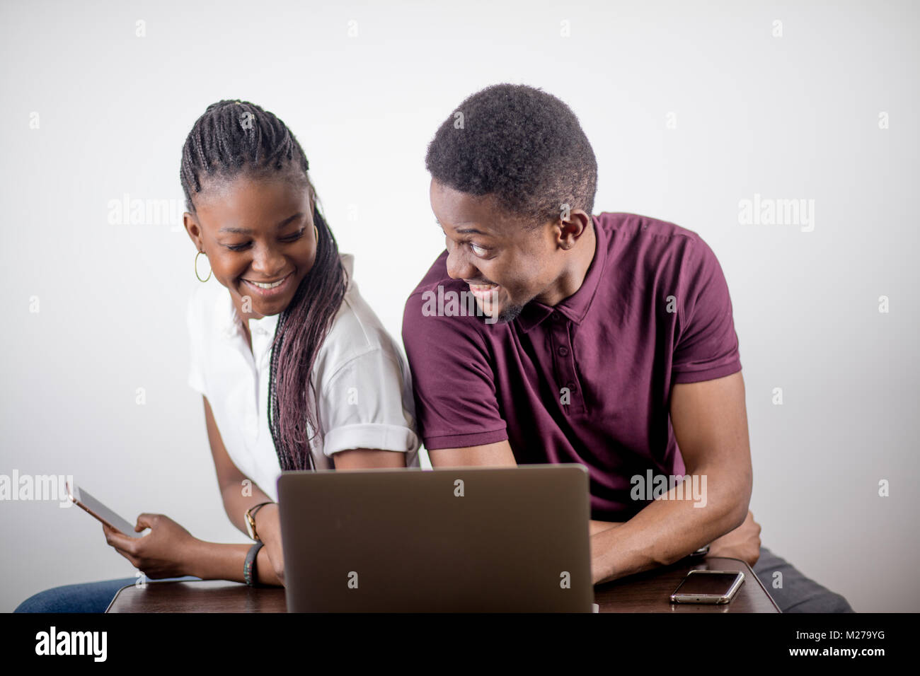 black girl sitting in front of laptop s looking on screen Stock Photo ...