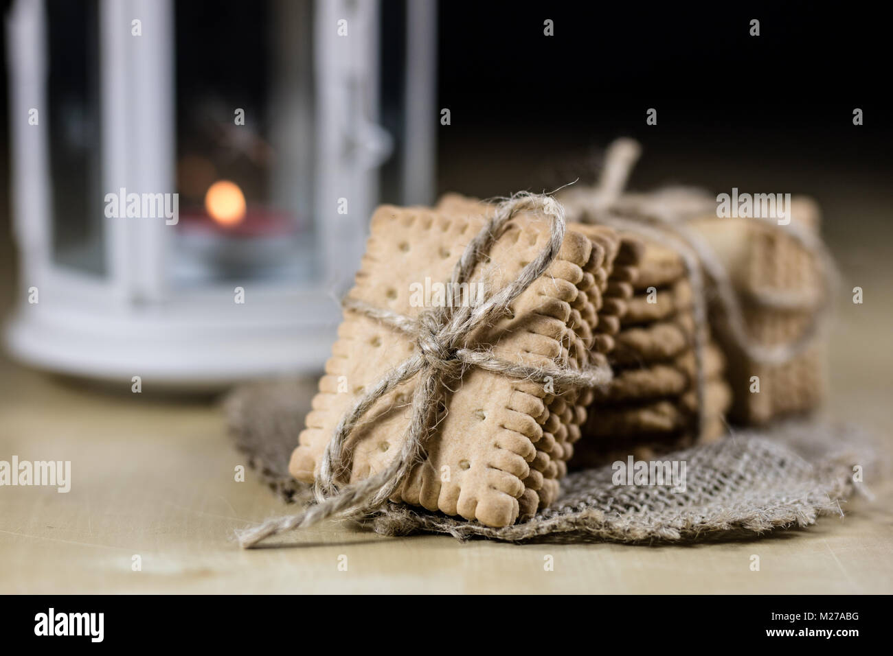 Cookies tied with a gray jute string into a bow. Cookies of sweets on a ...