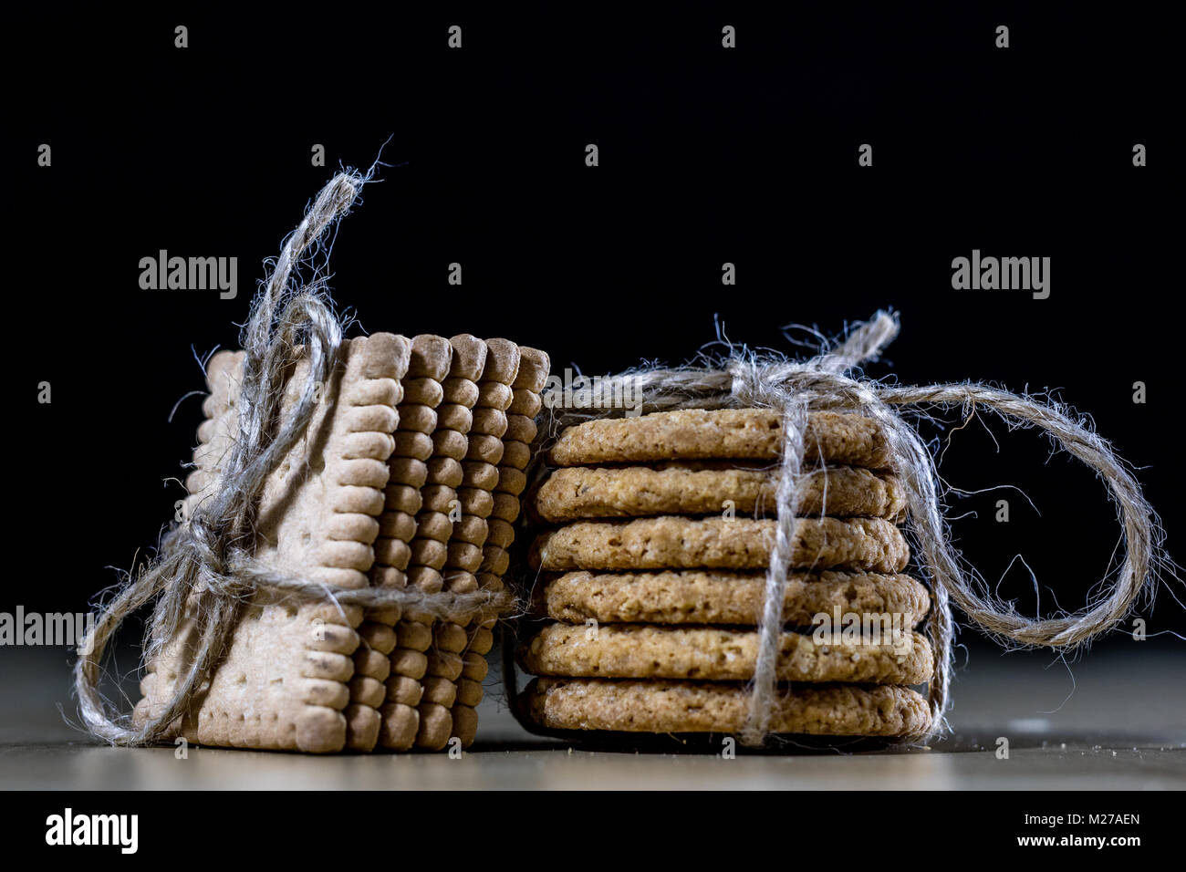 Cookies tied with a gray jute string into a bow. Cookies of sweets on a ...