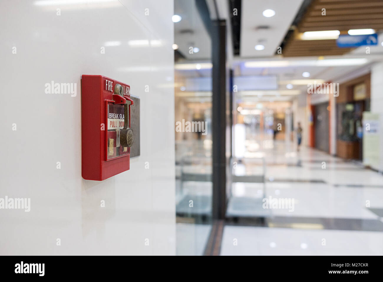 Fire alarm on the wall of shopping mall warning and security system ...