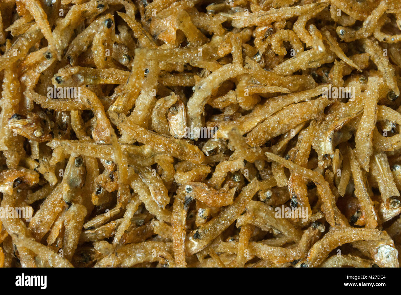 small crispy fried fish background Stock Photo - Alamy