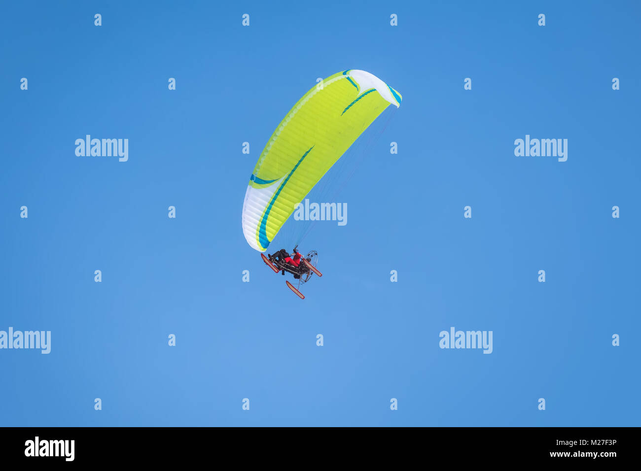 Powered parachute against the blue sky. Extreme sports. Paragliding ...