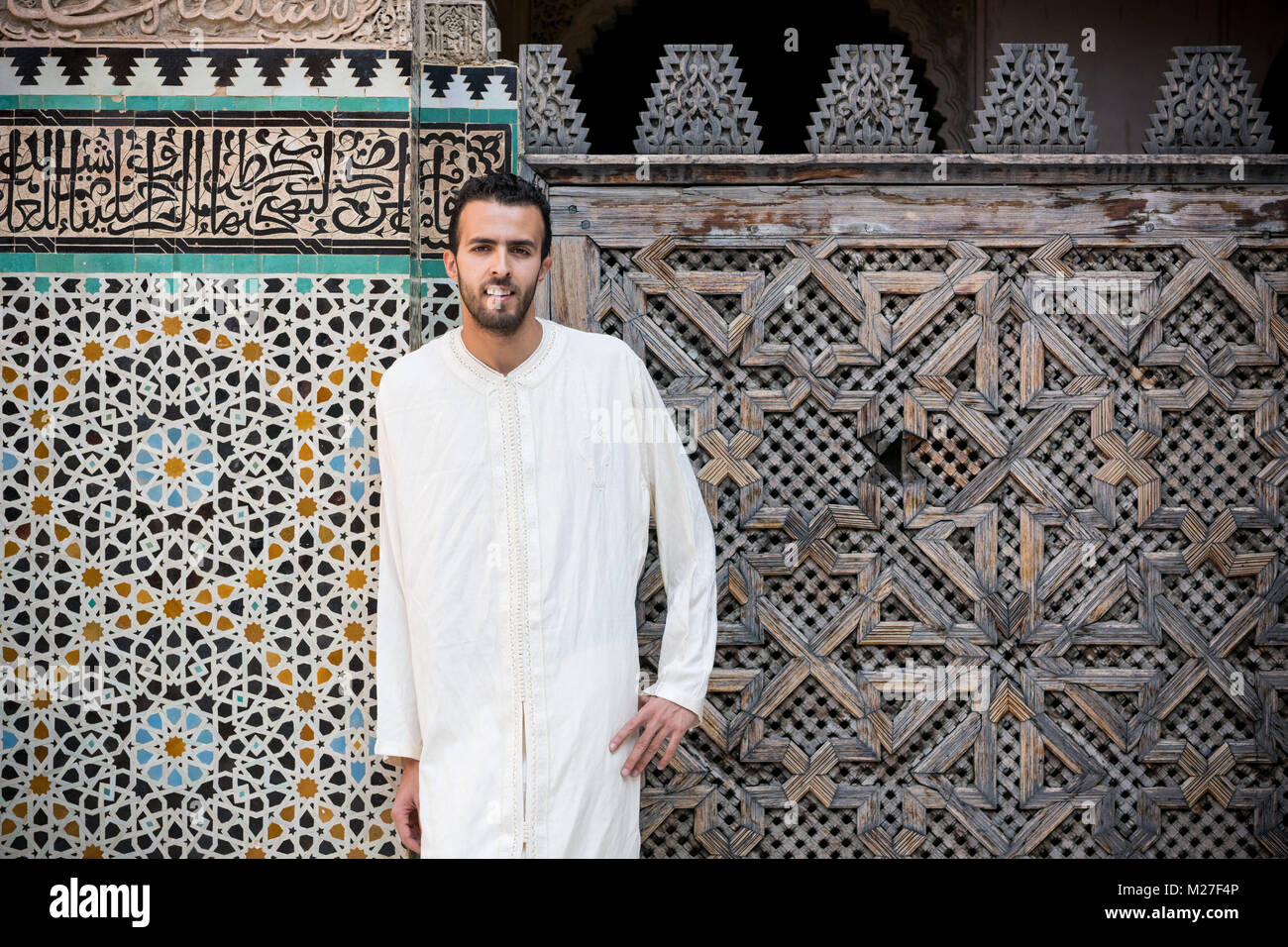 Muslim man in traditional clothing wearing long white shirt standing in ...