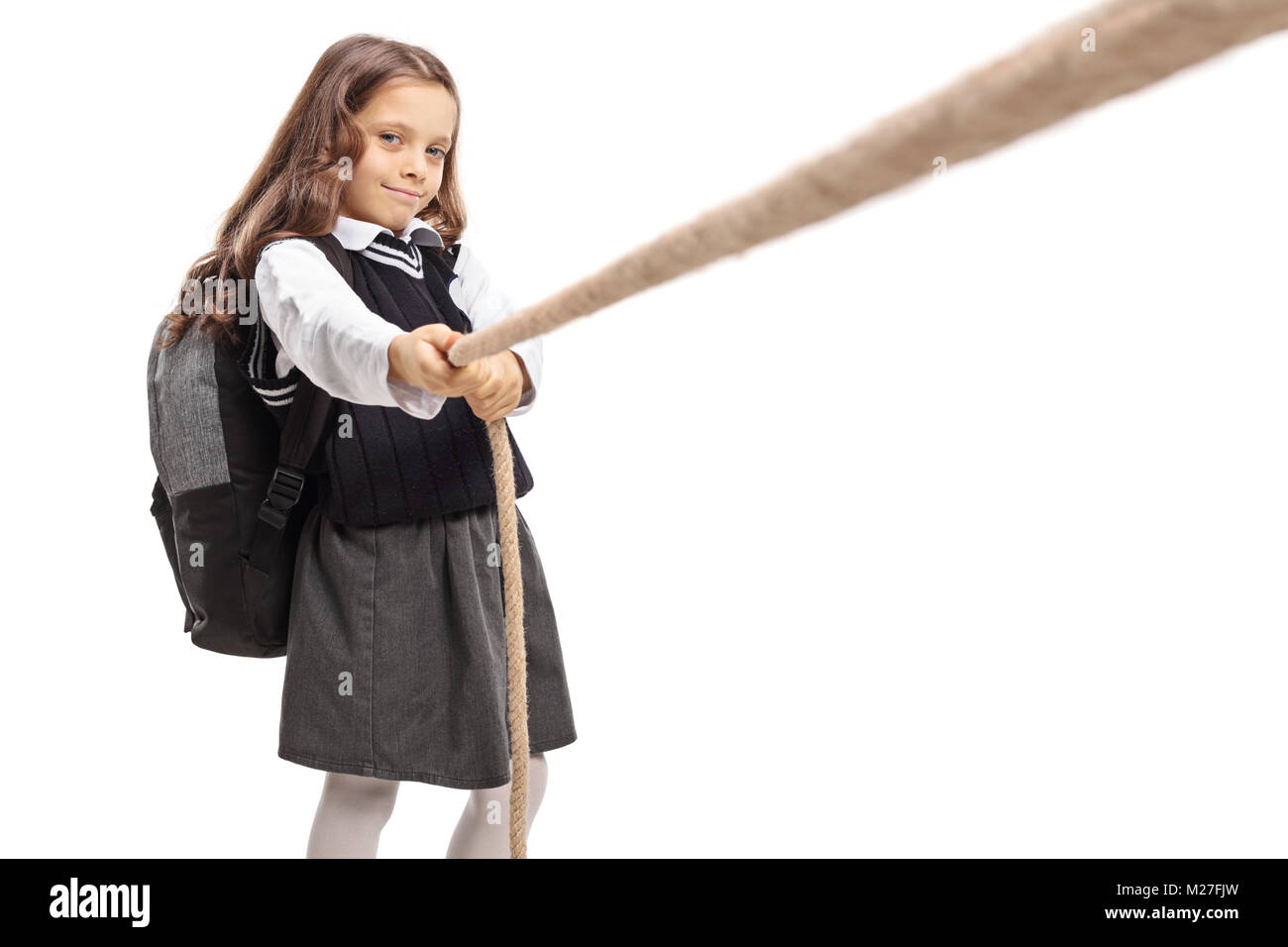 Little schoolgirl pulling a rope isolated on white background Stock ...