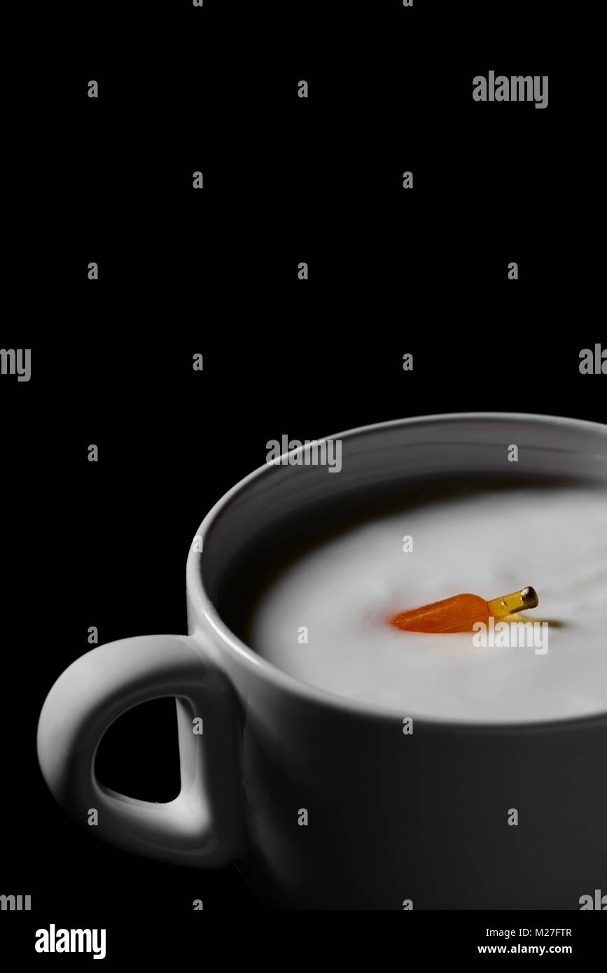Bottle floating in a cup of milk Stock Photo - Alamy