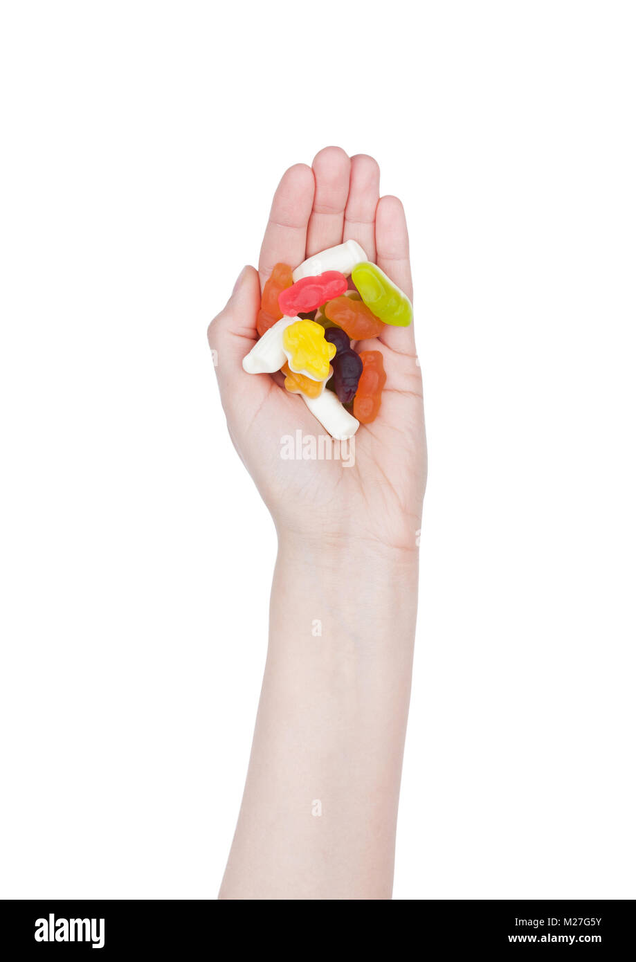 Female hand hold gummy color candies on white background Stock Photo ...