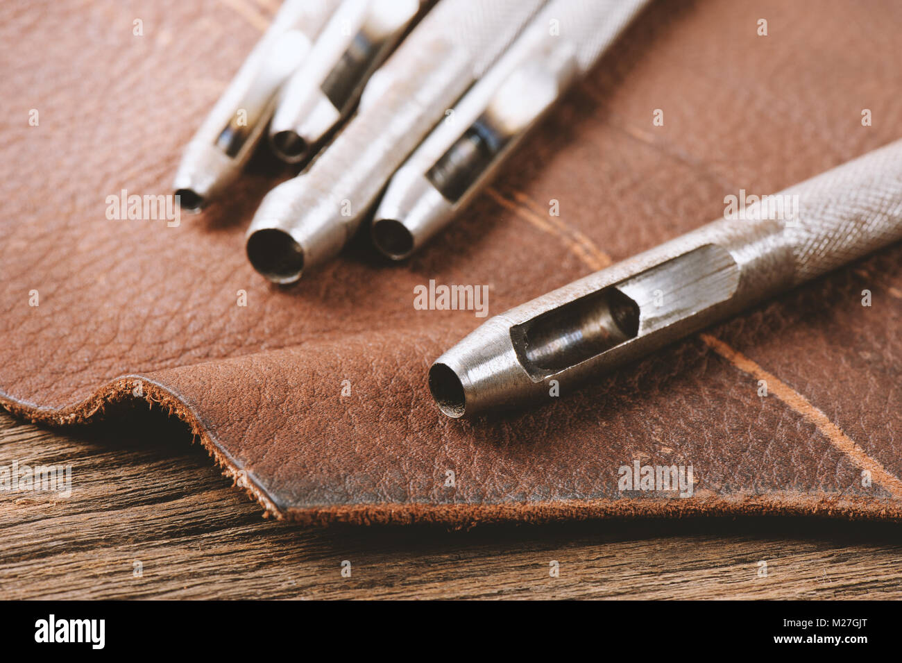 metal round puncher for leather work and DIY Stock Photo - Alamy