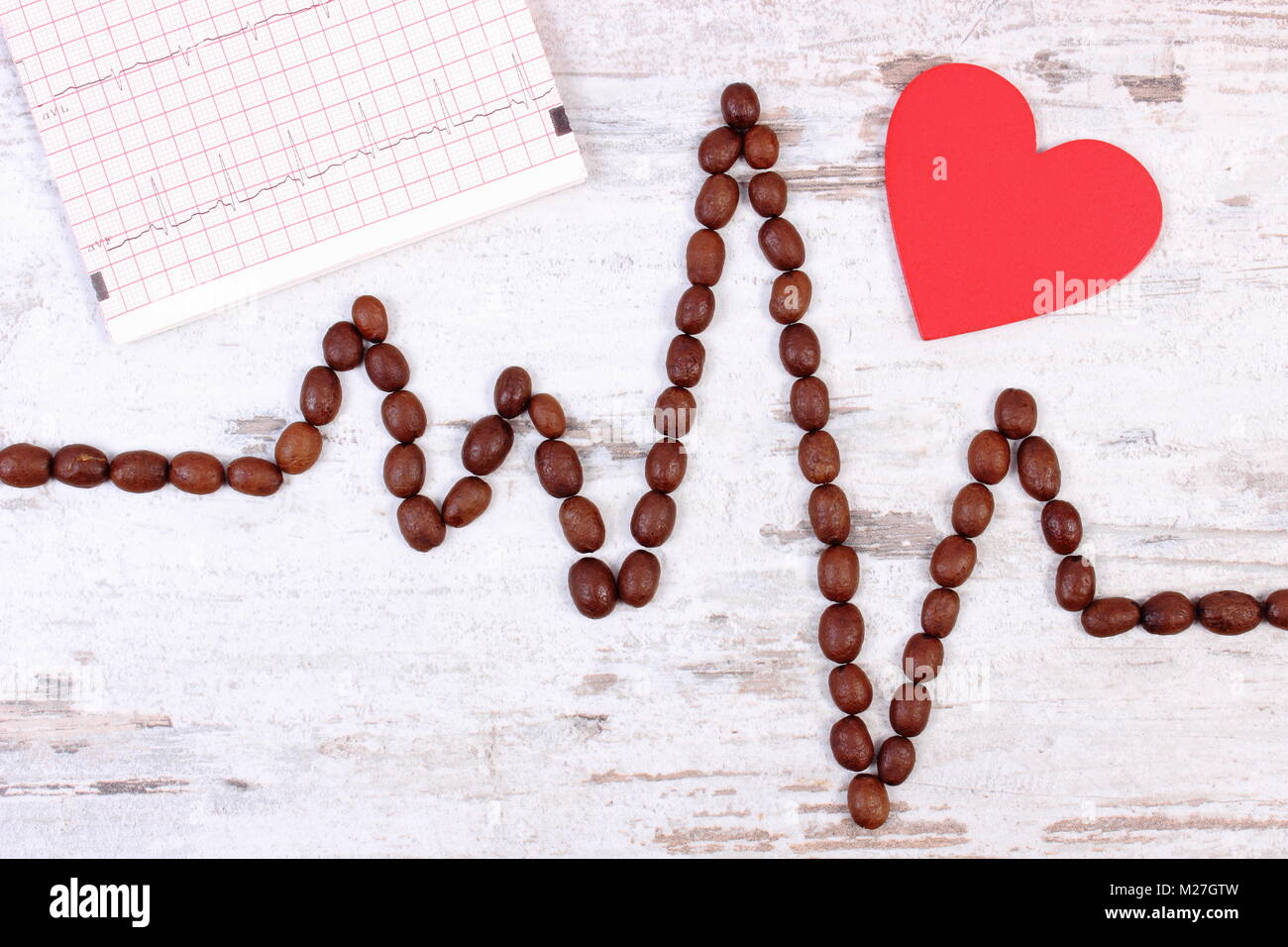 Cardiogram line made of coffee grains and electrocardiogram graph on ...
