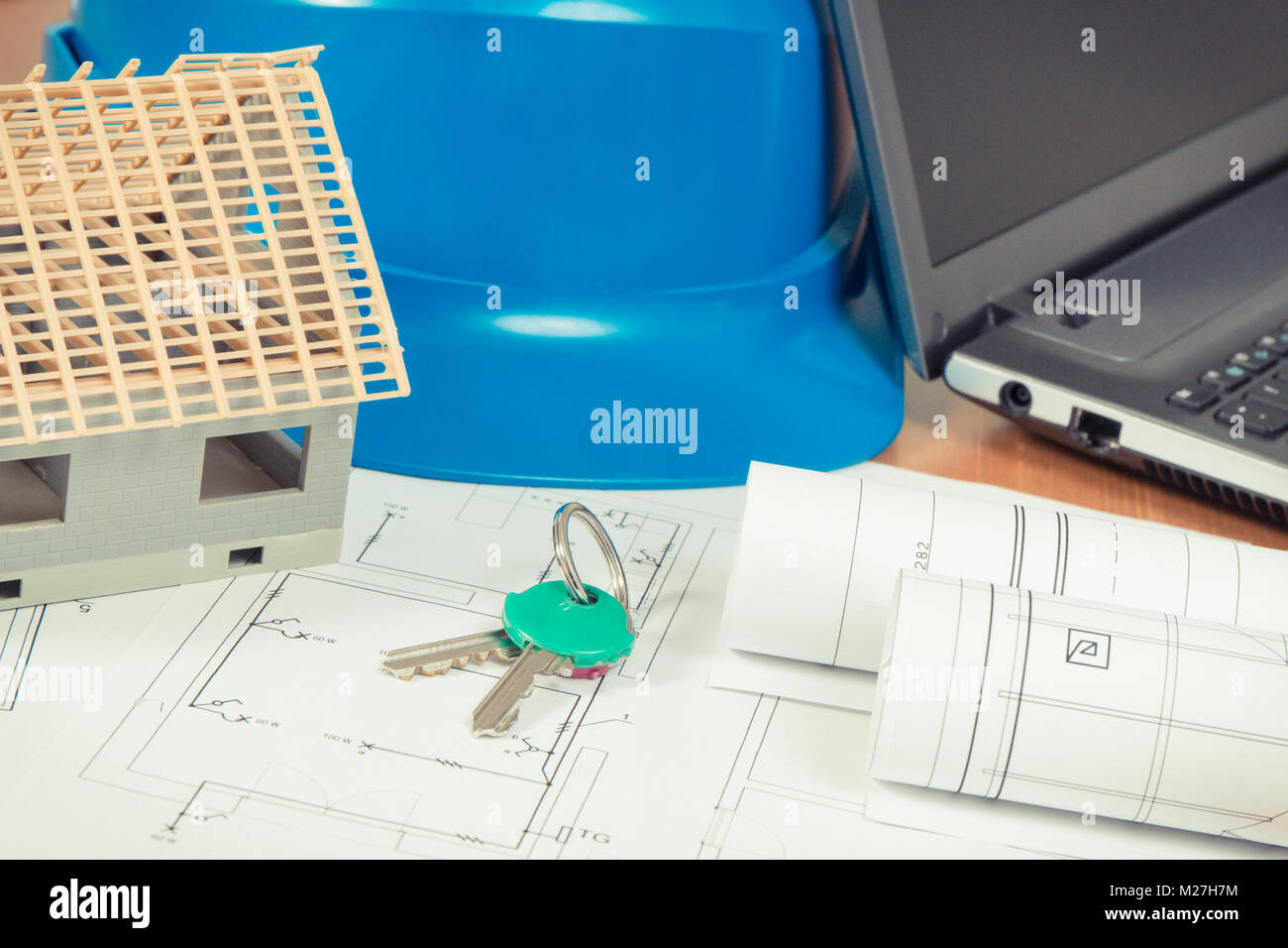 Home keys, small house under construction, electrical diagrams with ...