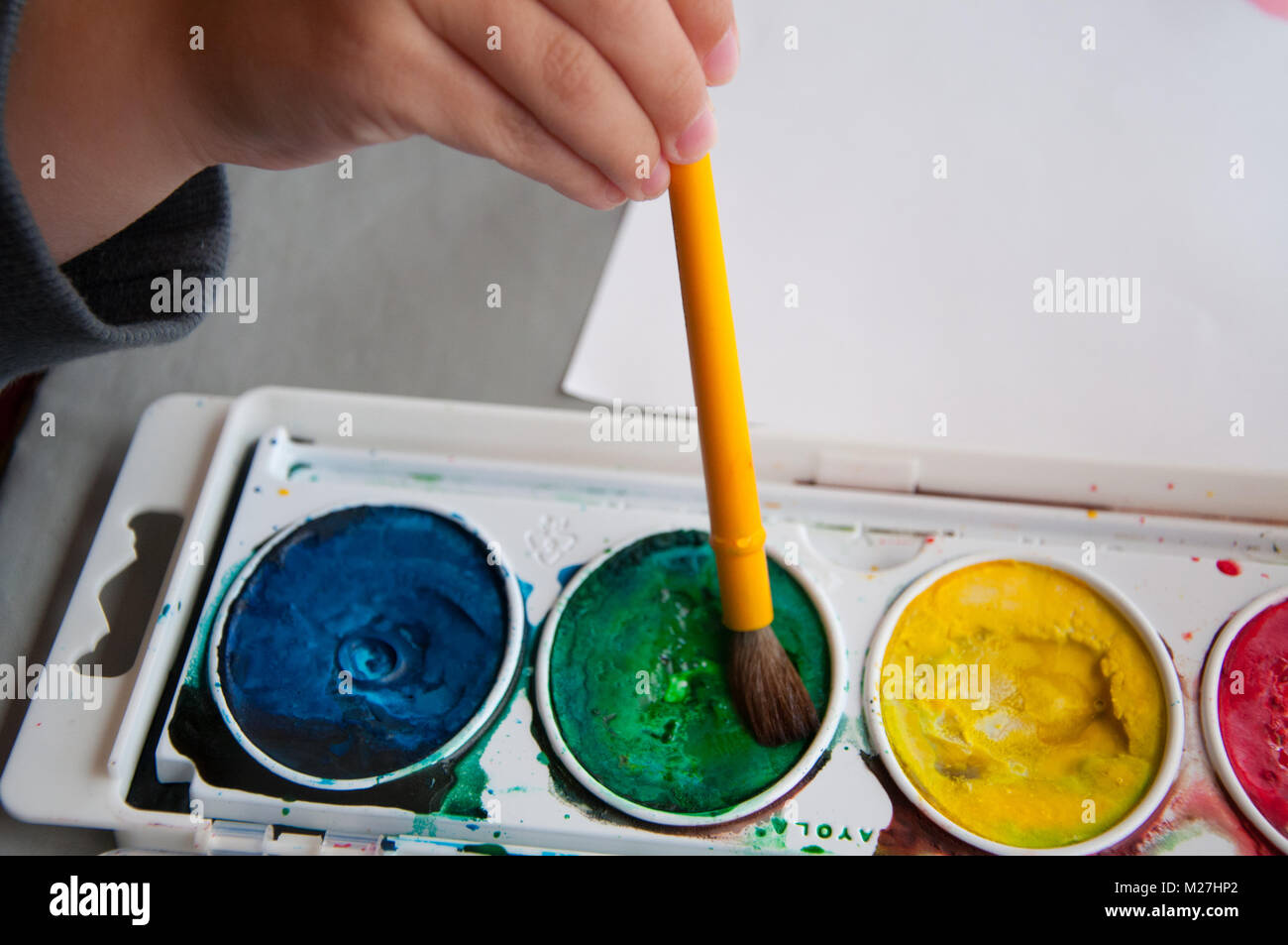 Child Painting With Water Colours Stock Photo - Alamy