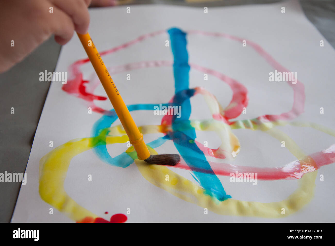 Child Painting With Water Colours Stock Photo - Alamy