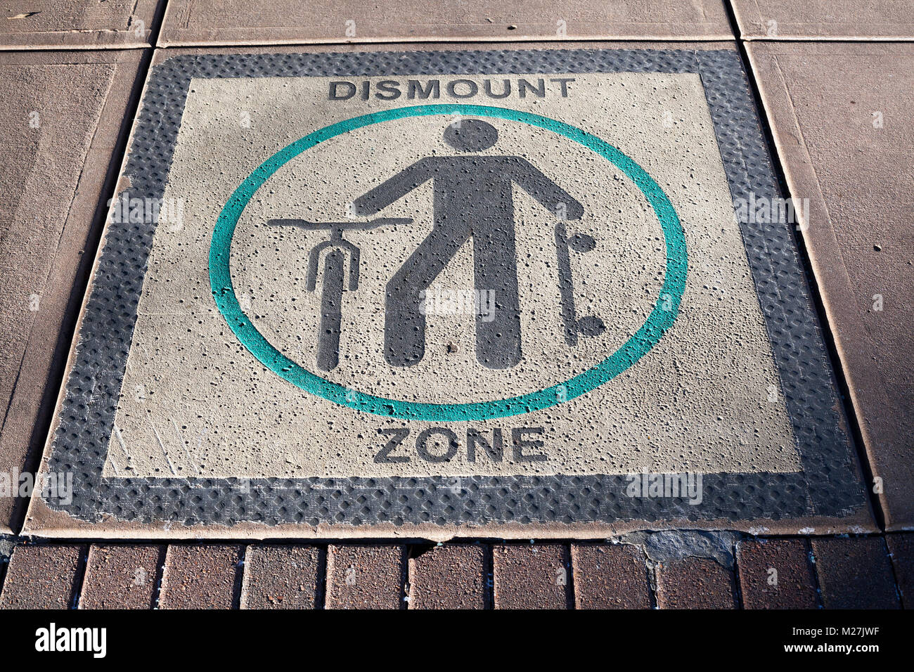 A "Dismount Zone" sign in Fort Collins, Colorado, USA informs ...